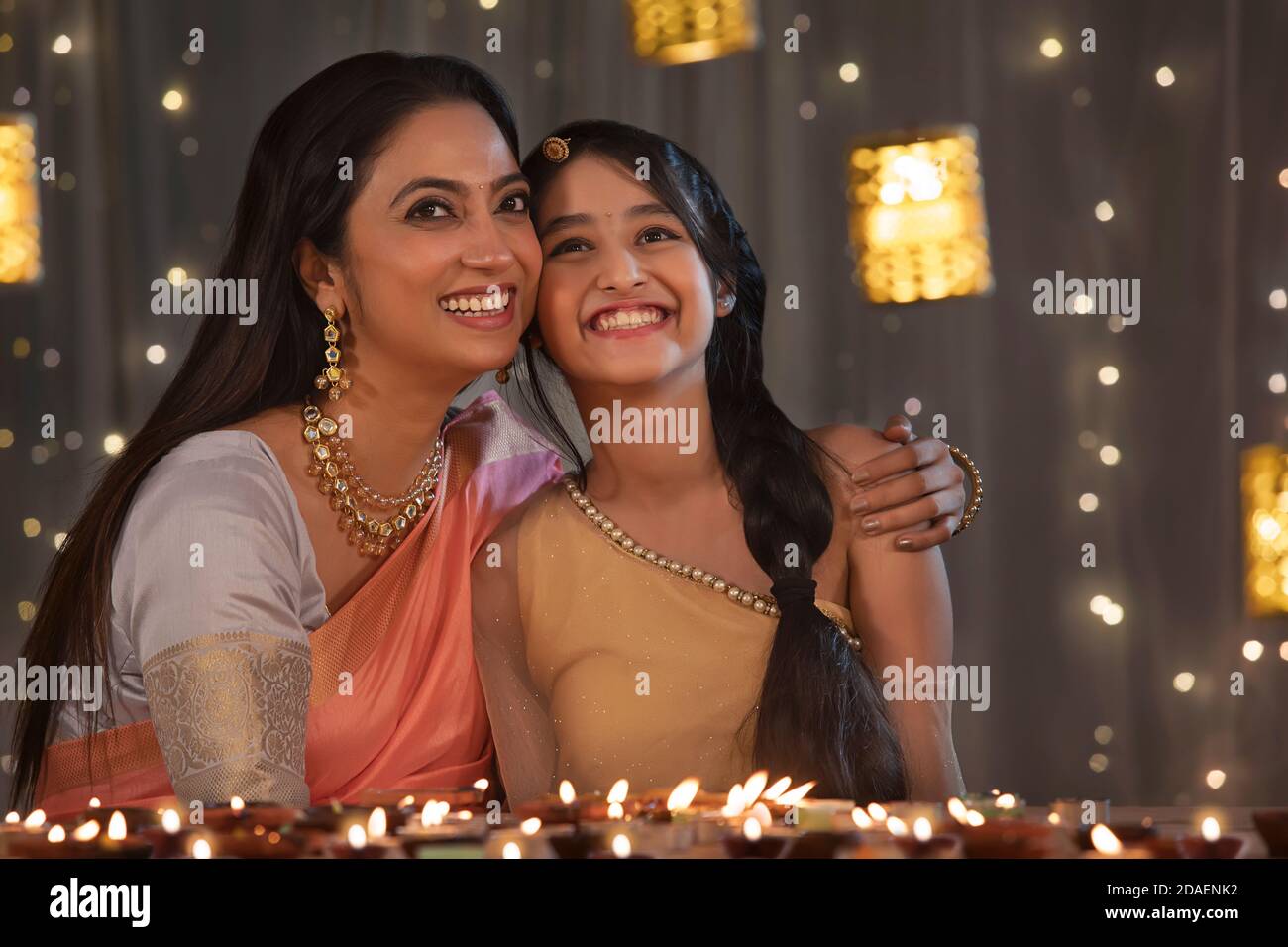 Mother and daughter smiling together Stock Photo - Alamy