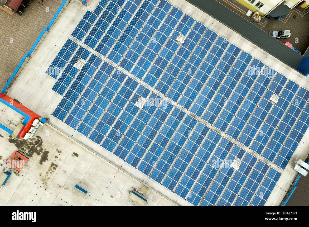 Aerial view of solar power plant with blue photovoltaic panels mounted ...