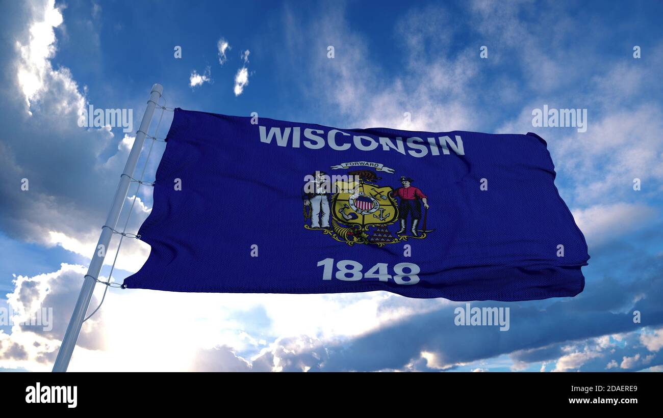 Wisconsin flag on a flagpole waving in the wind, blue sky background ...