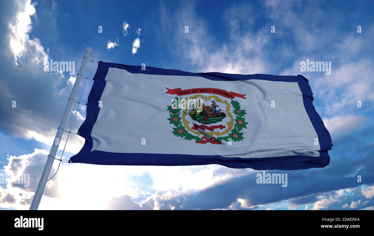 West Virginia flag on a flagpole waving in the wind, blue sky ...