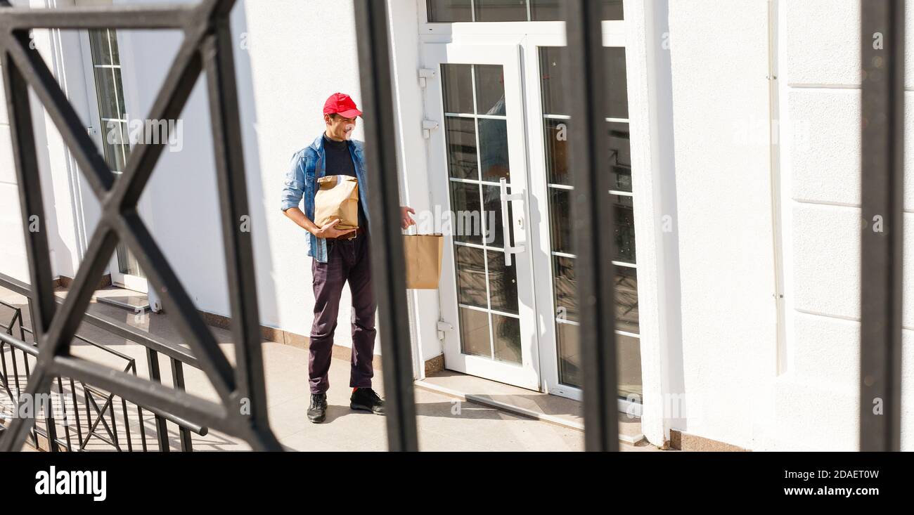 Man Delivering Online Grocery Order Stock Photo - Alamy