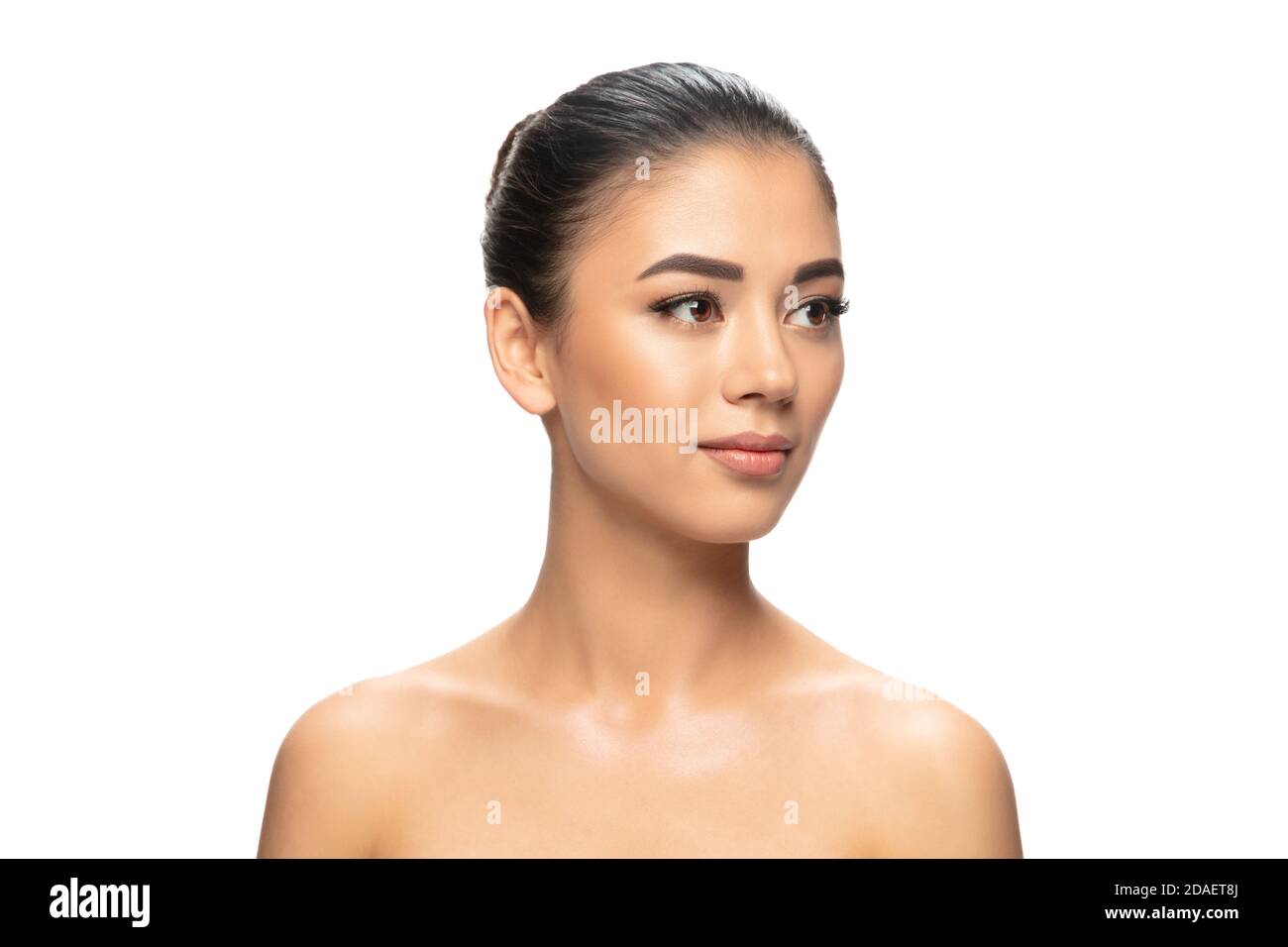 Well-kept. Portrait of beautiful young woman on white studio background ...