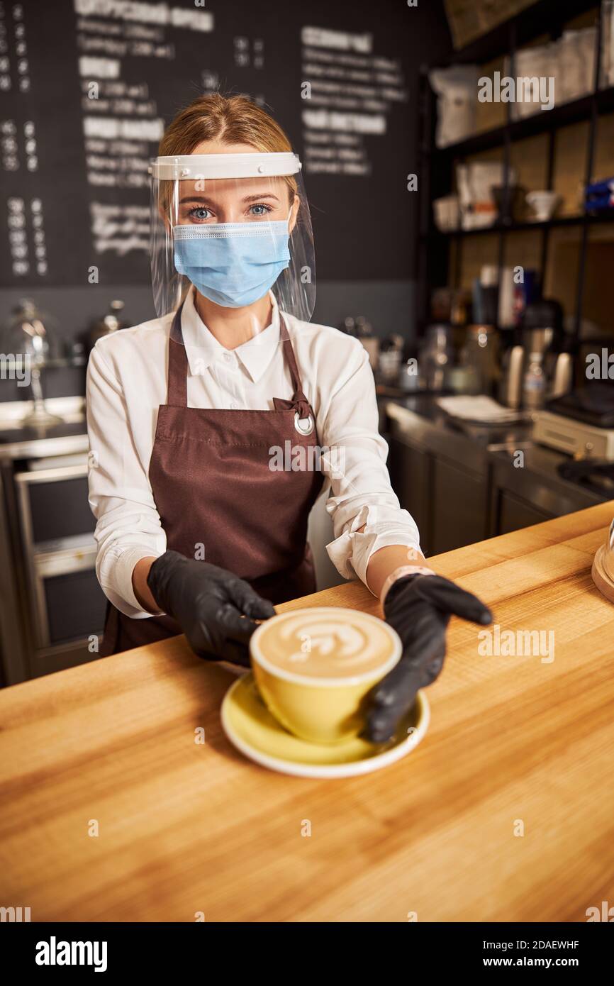 Please take your order and enjoy this hot beverage Stock Photo - Alamy