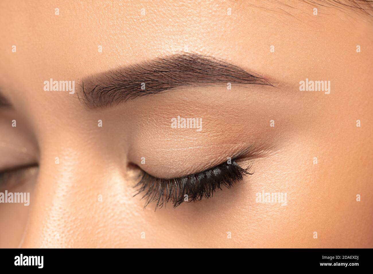 Eyelids. Close up portrait of beautiful young woman on studio ...