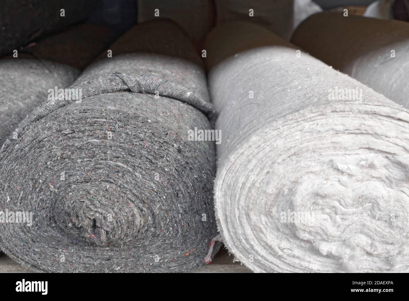 Rolls of factory textiles close-up. Raw material or material for the ...