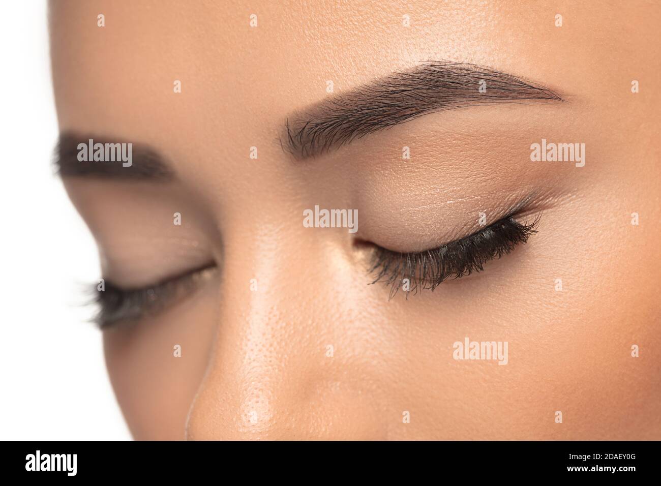 Eyelids. Close up portrait of beautiful young woman on studio ...