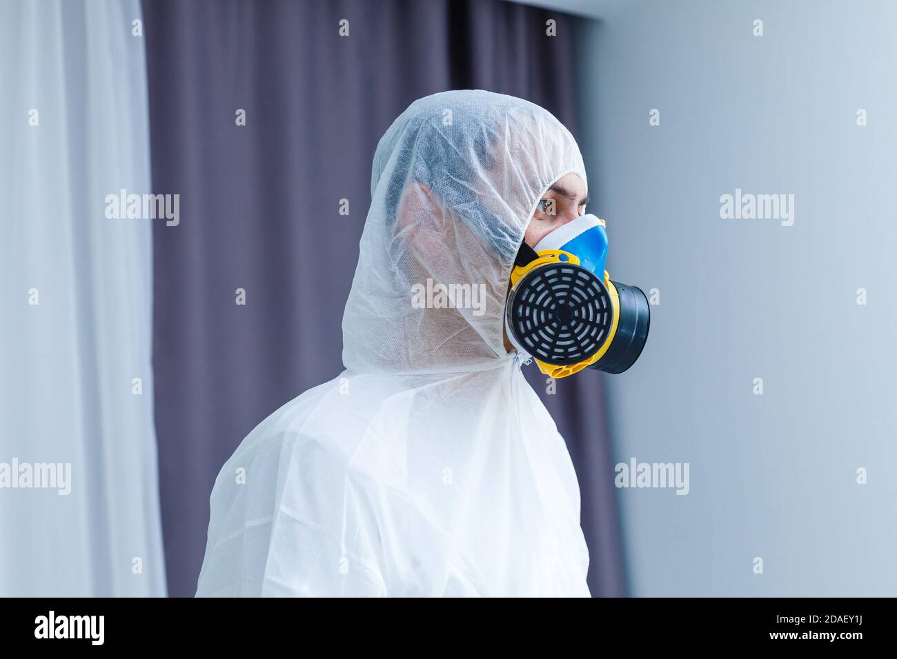 Man in protective clothing and a gasmask on a white background Stock ...