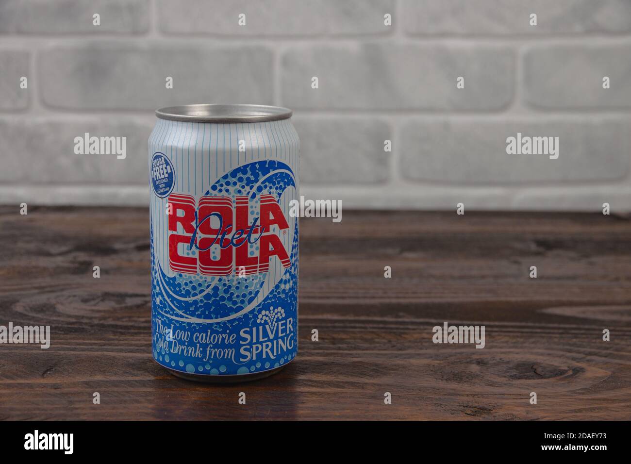 An old aluminium can of Rola Cola soft drink against the brick wall ...