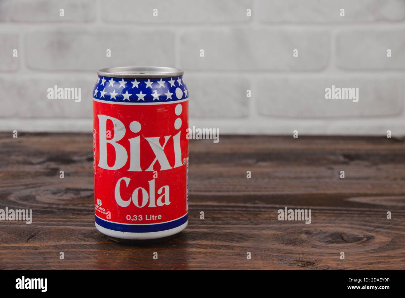 A vintage aluminium can of Bixi Cola soft drink against the brick wal ...
