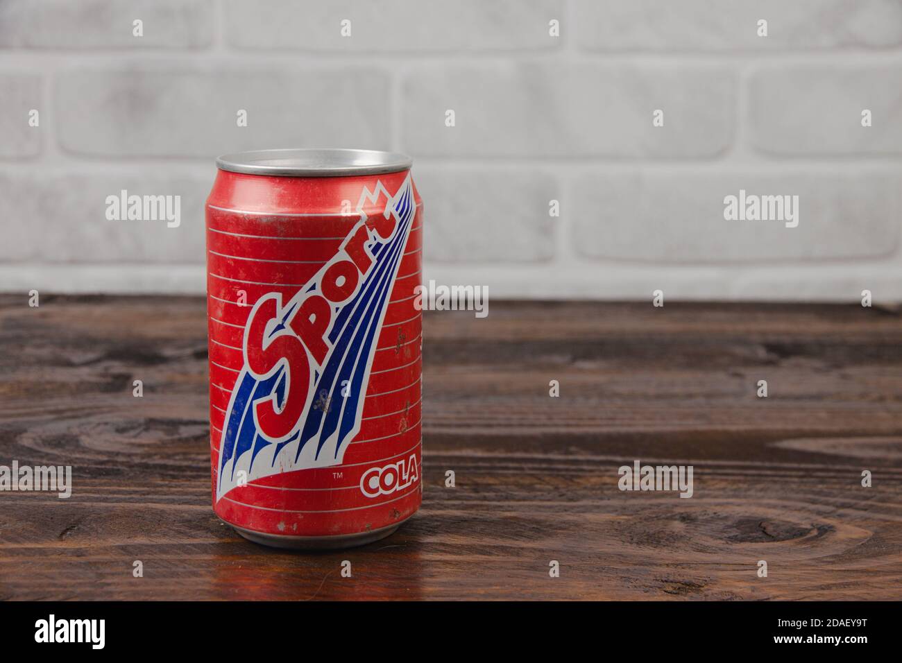 A vintage aluminium can of Sport Cola soft drink against the brick wal ...