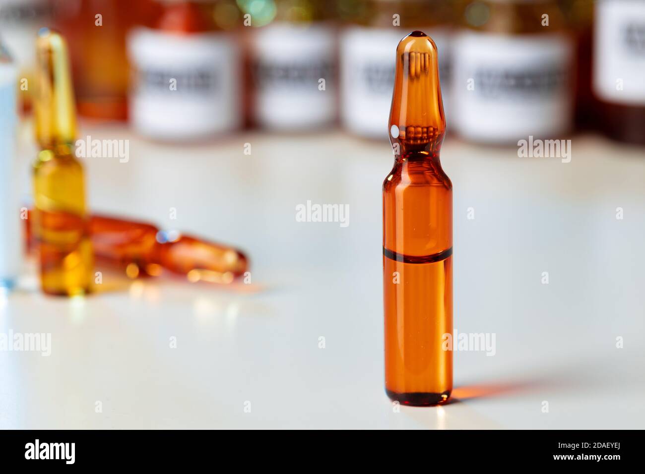 Pile of glass medical vials with medication on lab table Stock Photo ...