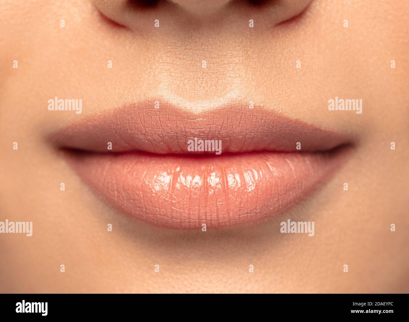 Lips. Close up portrait of beautiful young woman on studio background ...