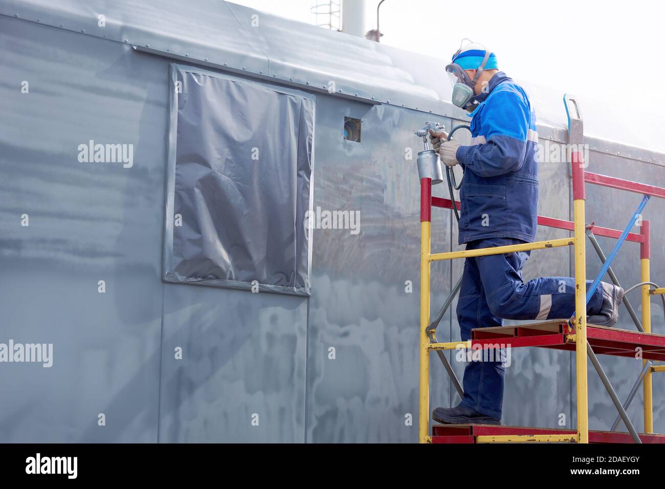 Industrial work. Priming of metal products from the compressor gun. A ...