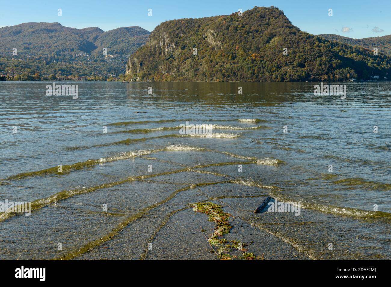 Current that forms waves at the lake of Lugano in Switzerland Stock ...