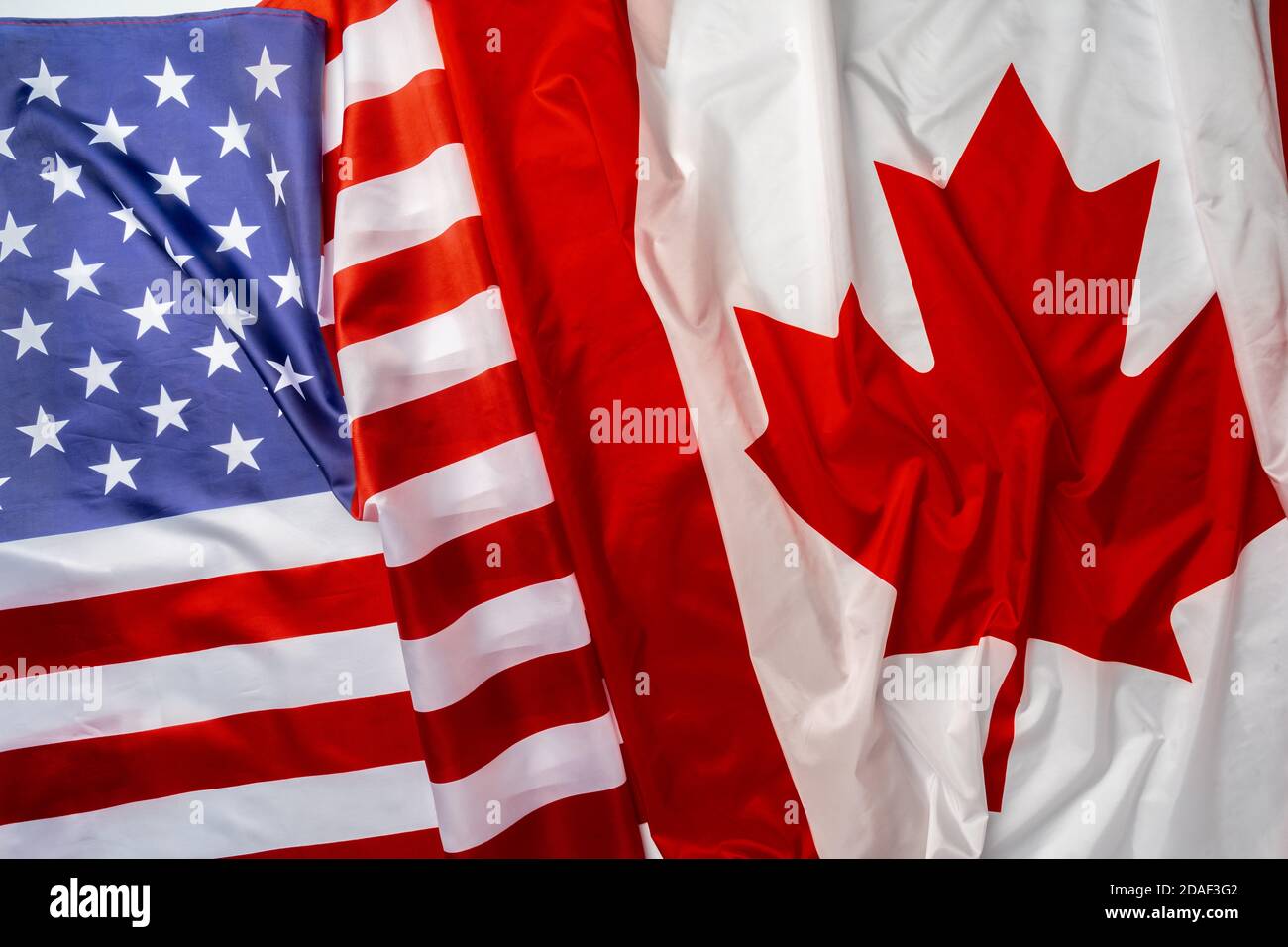 Flags of Canada and USA folded together Stock Photo - Alamy