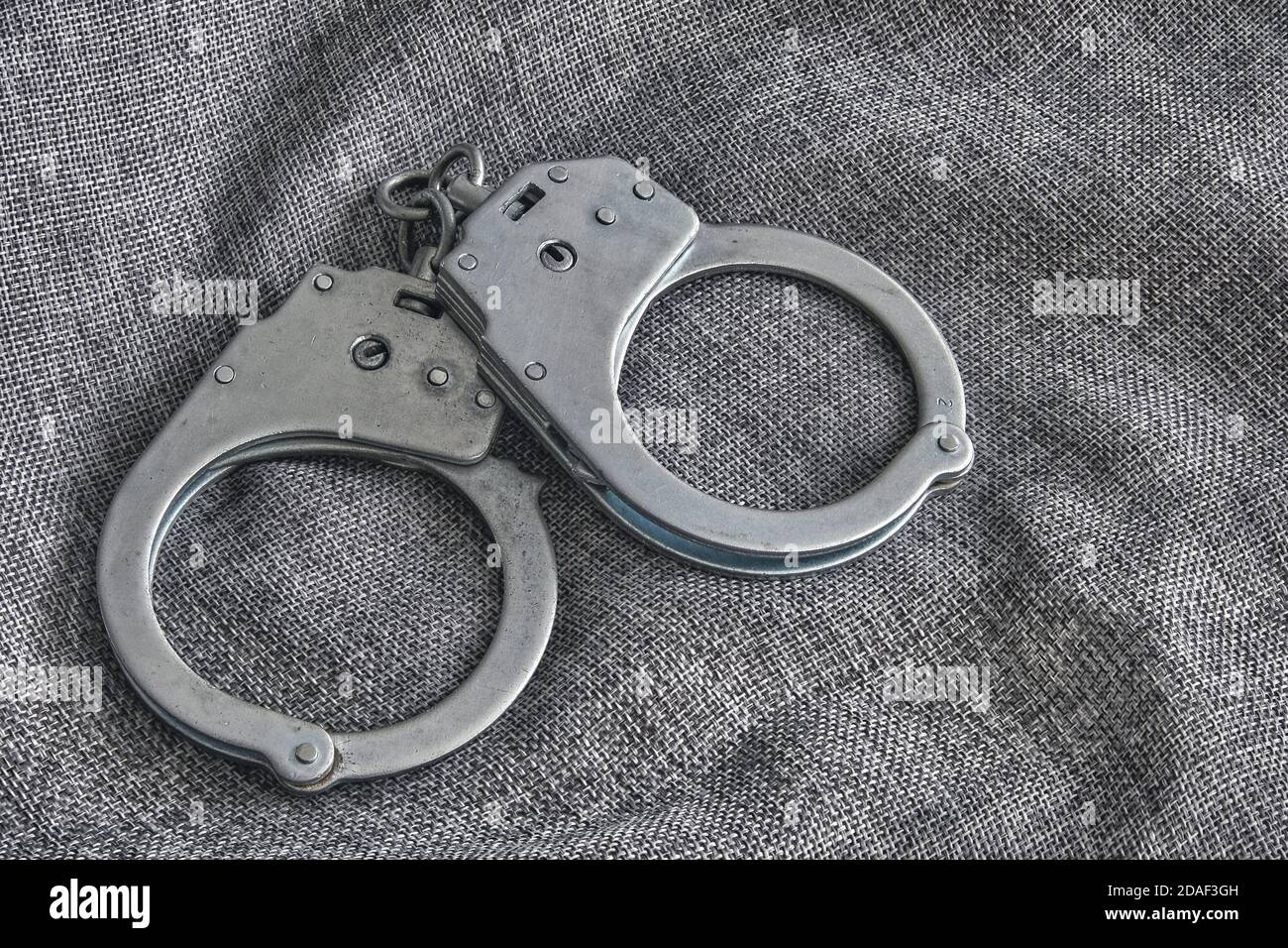 Handcuffs on a dark background. The concept of justice. Abstract ...