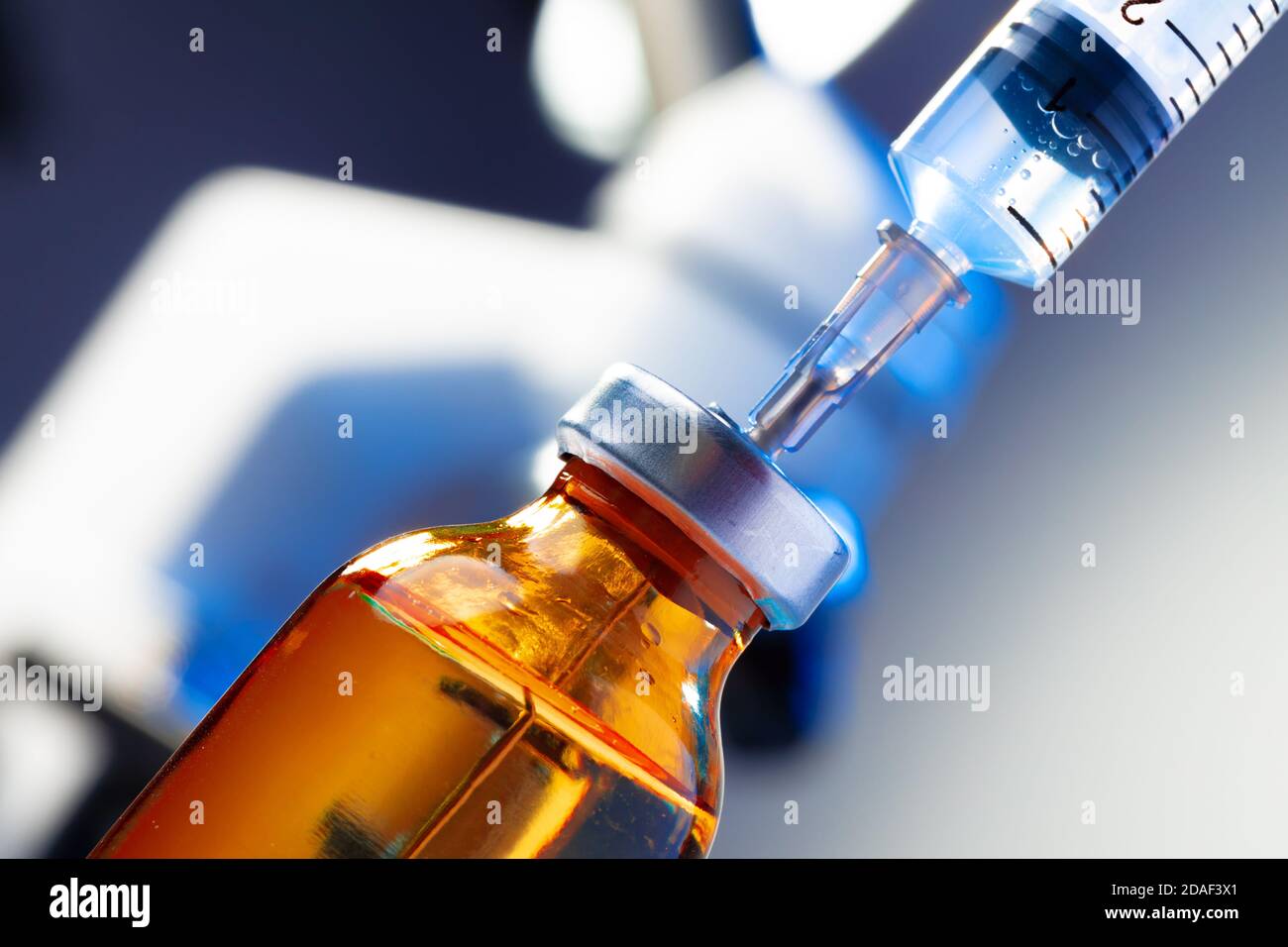Medical vial with medication and syringe close up Stock Photo - Alamy