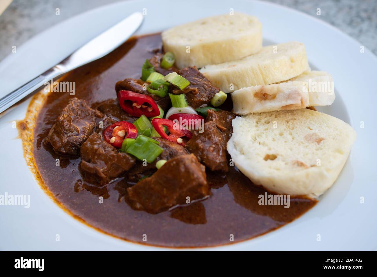 Traditional Czech Beef Goulash meal on a plate with bread Stock Photo ...