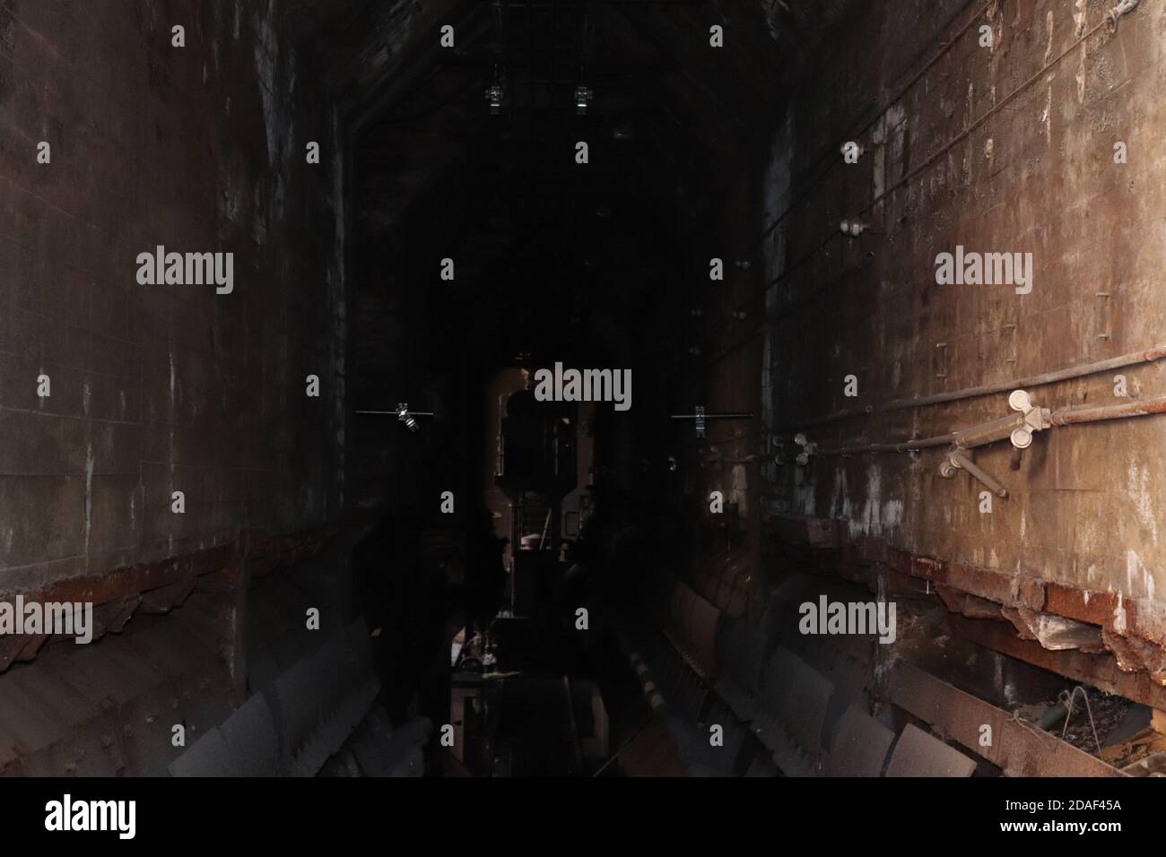 Creepy abandoned factory hallway Stock Photo - Alamy