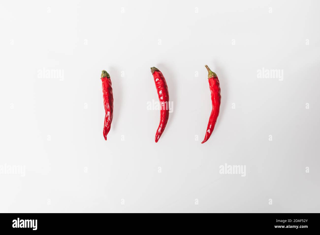 Overhead shot of three chilies on an isolated background Stock Photo ...