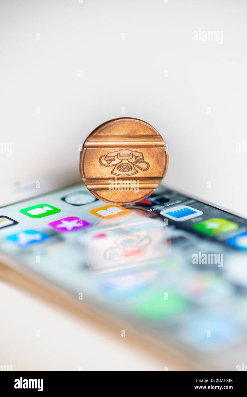 Old Italian Telephone Token Coin Leaning on the Smartphone Screen Stock ...