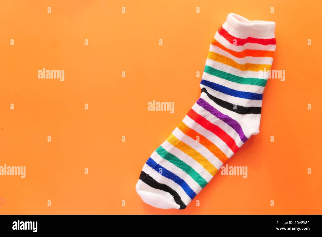 colorful sock on orange background with copy space Stock Photo - Alamy