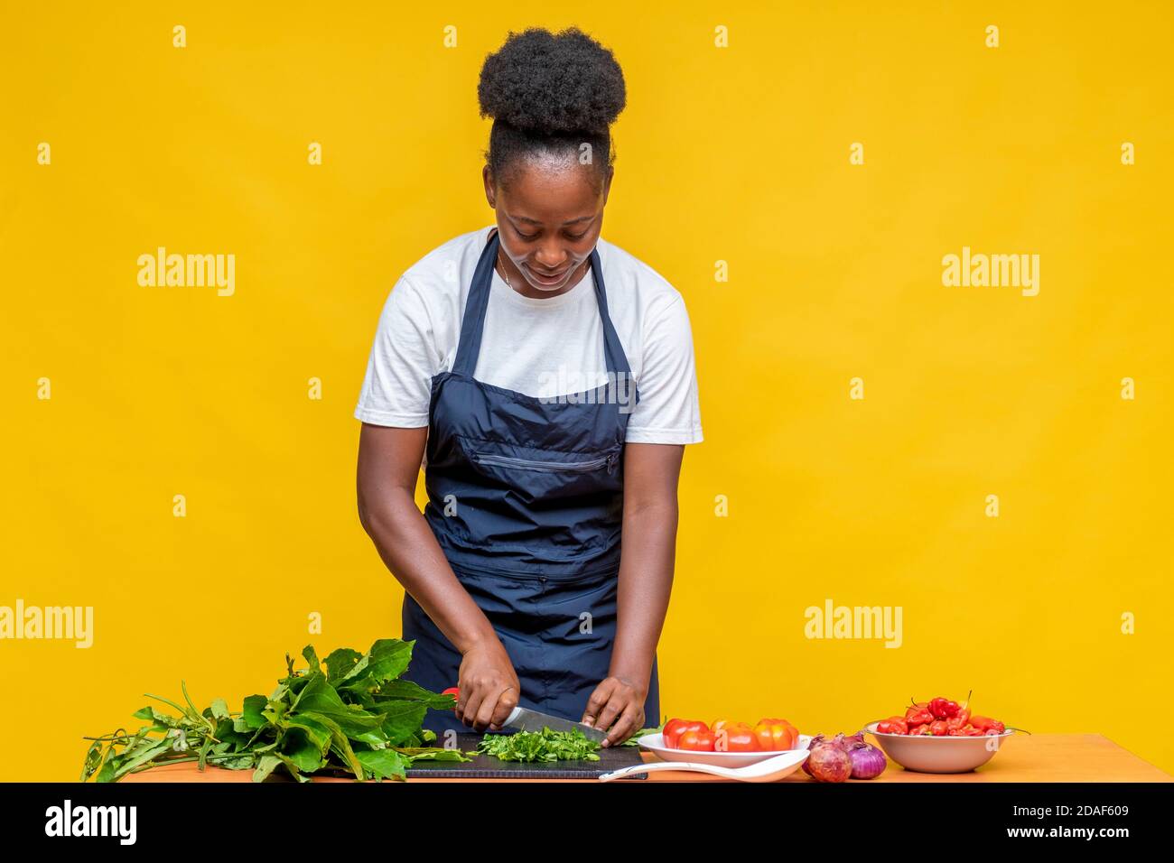 african lady chef chopping some vegetable Stock Photo - Alamy