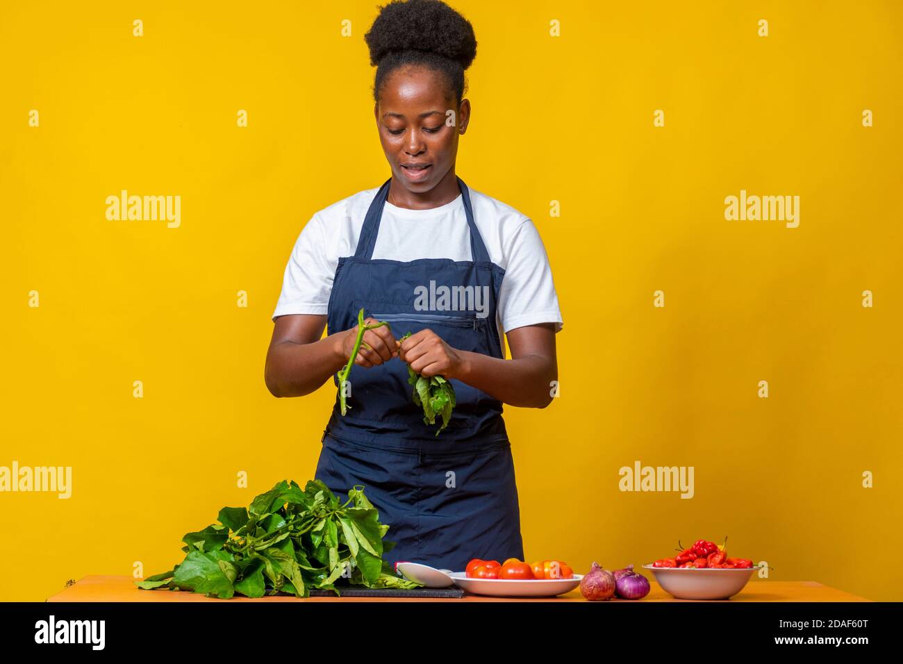black chef about to prepare a meal, preparing the ingredients Stock ...