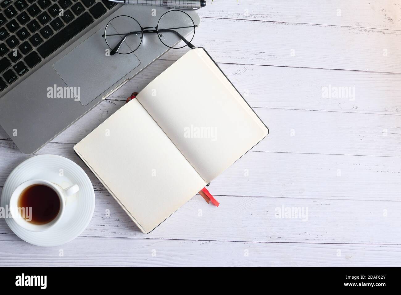 flat composition coffee, notepad and laptop on white background Stock ...