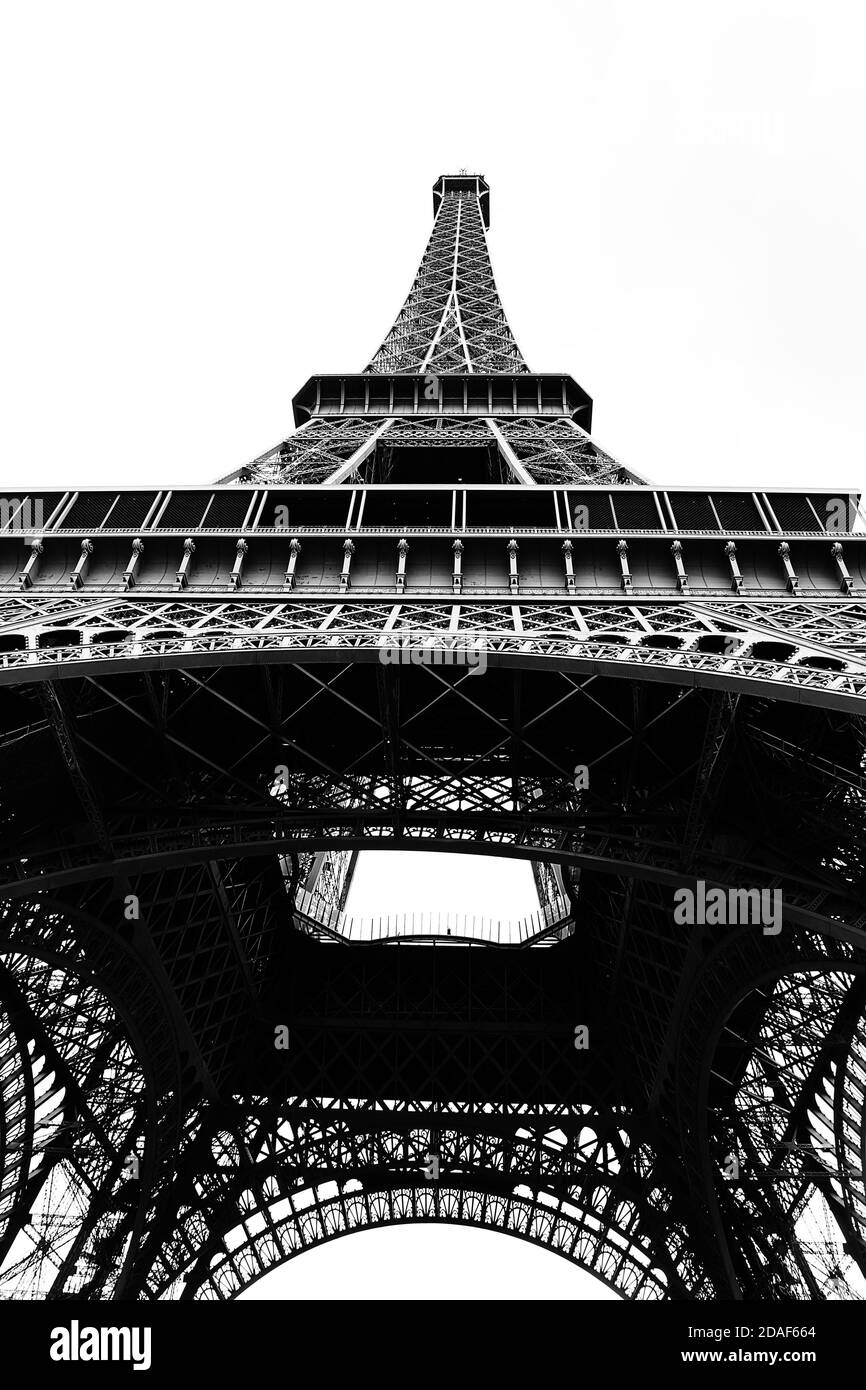 incredible views from below of the very tall Eiffel Tower with black ...