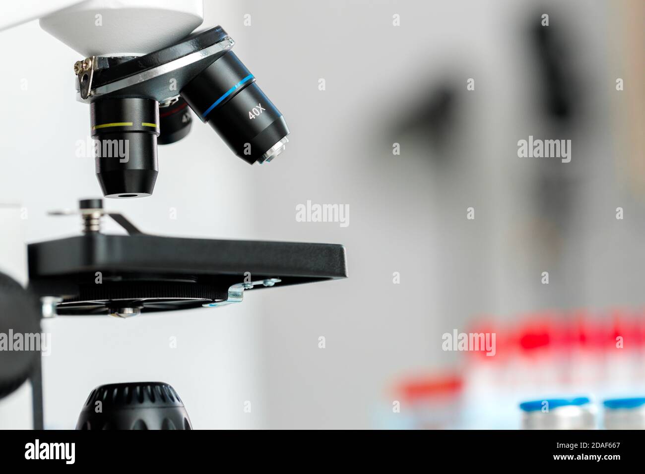 Microscope on the table with glassware in laboratory Stock Photo - Alamy