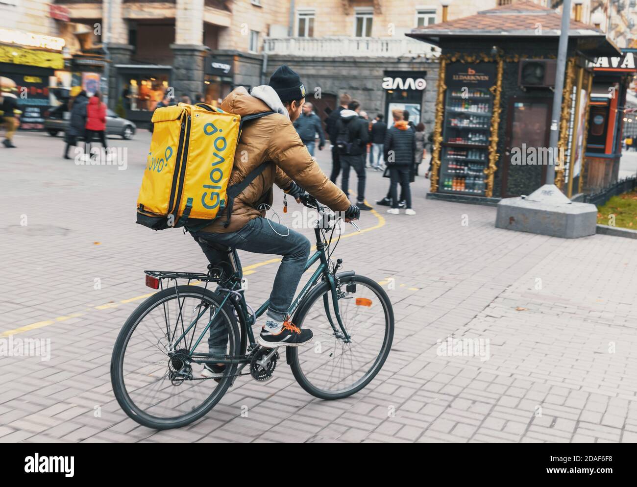 Kyiv, Ukraine - Nov. 16, 2019: A Glovo food delivery courier delivers ...