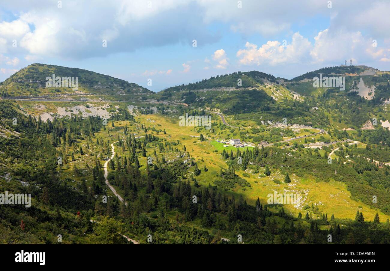 wide alpine landscape with mountains and coniferous forests in northern ...