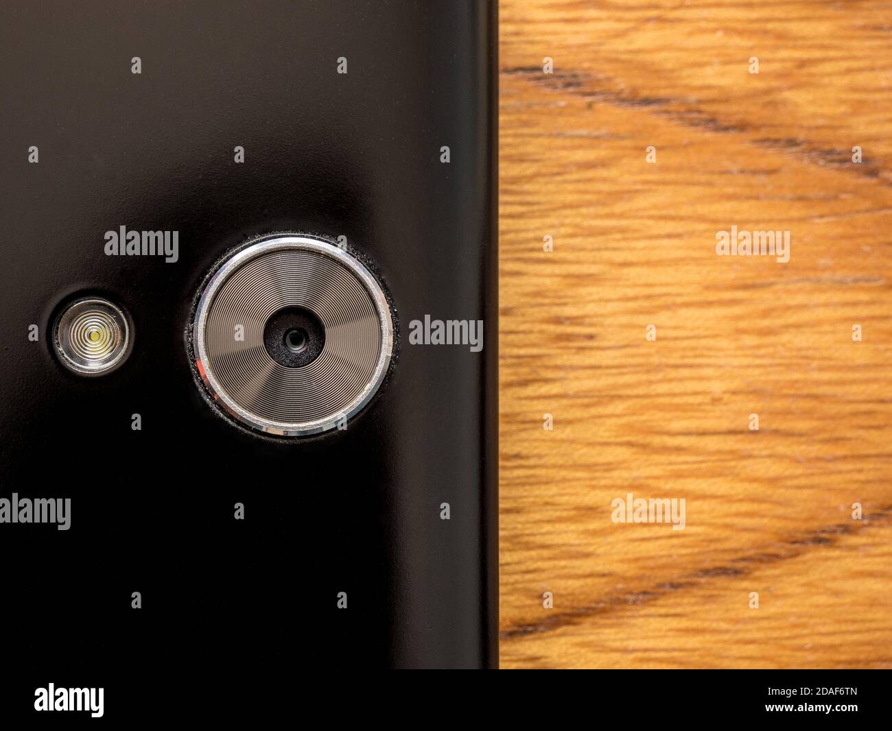 Closeup of a smart phone camera with lighting flash. On the right side ...