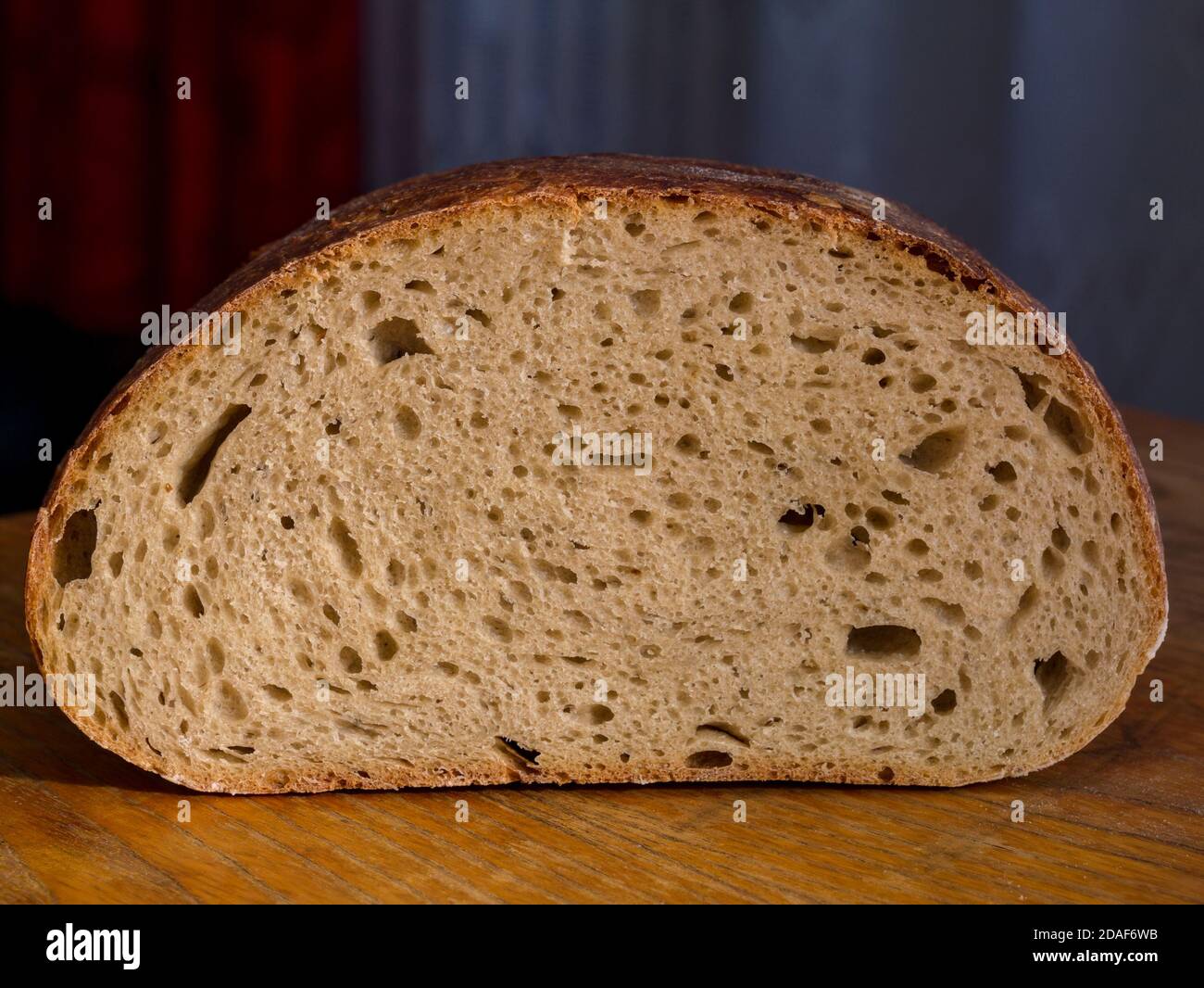 Traditional homemade bread - Side view of halved bread Stock Photo - Alamy