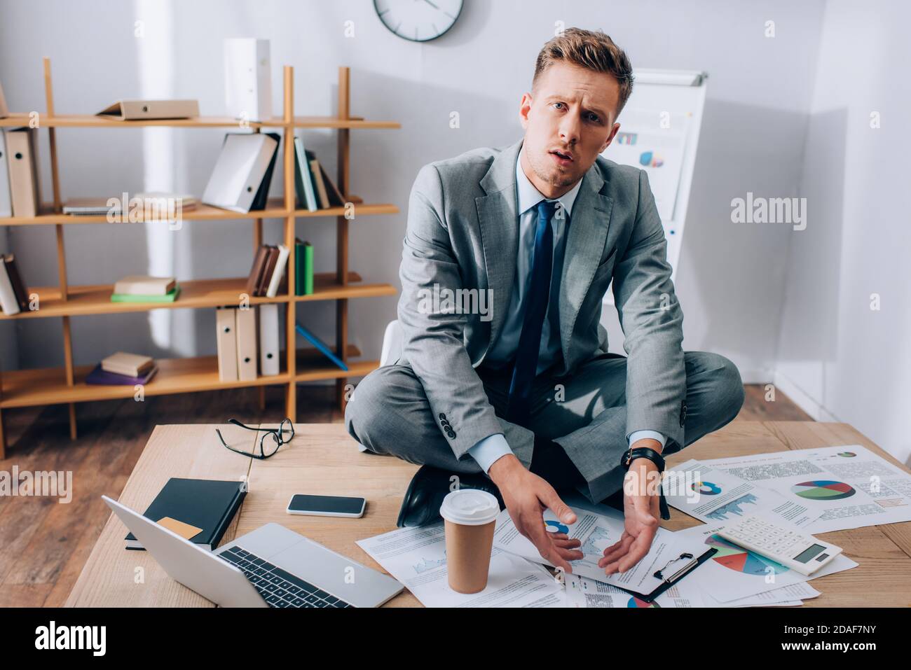 Confused man papers hi-res stock photography and images - Alamy