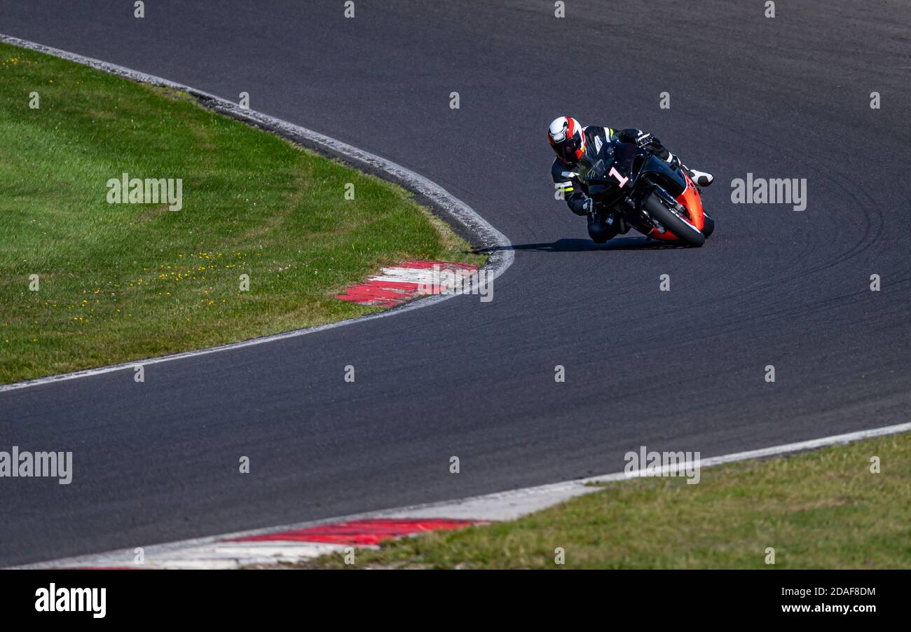 A shot of a racing bike cornering on a track Stock Photo - Alamy