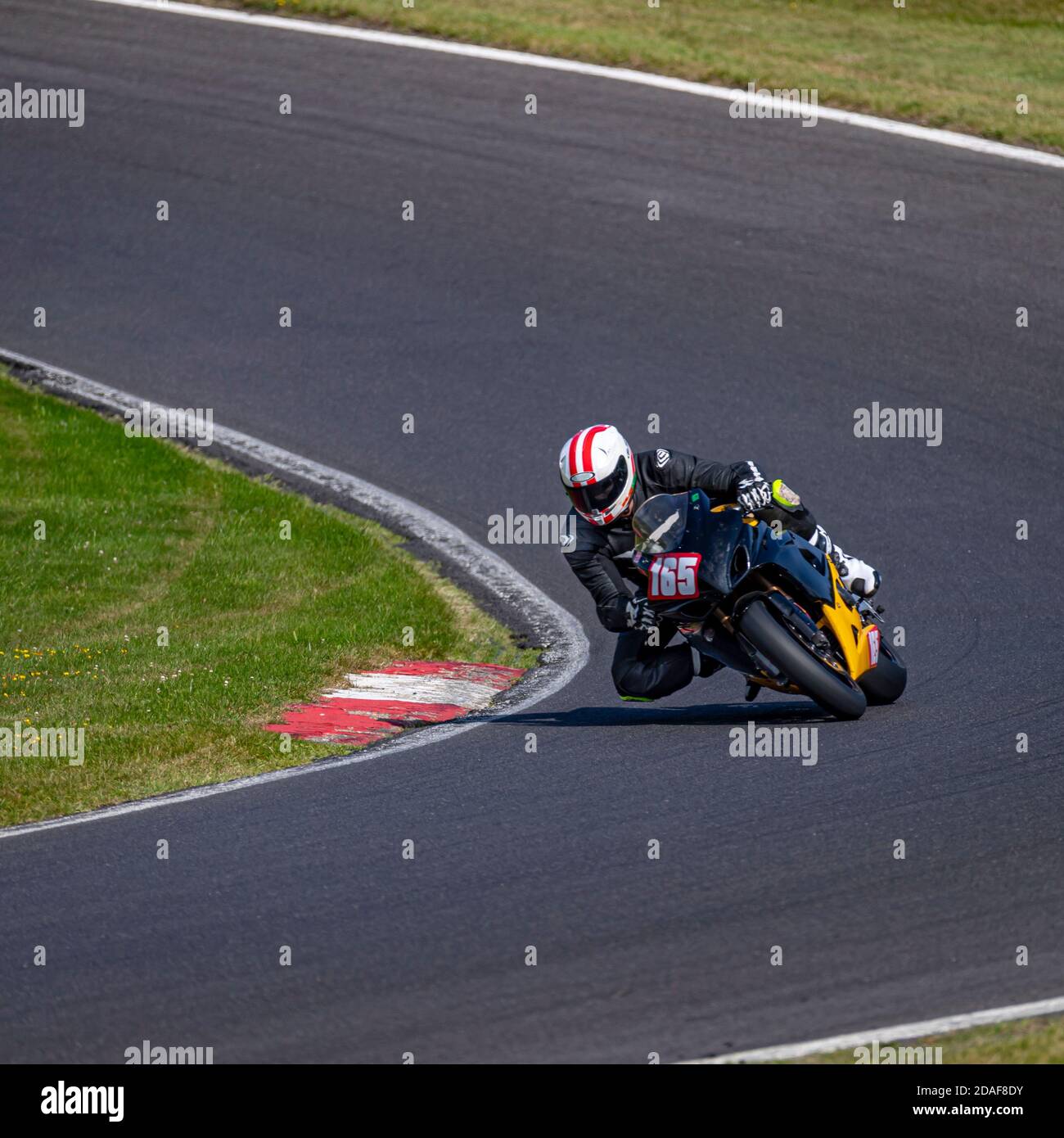 A shot of a racing bike cornering on a track Stock Photo - Alamy