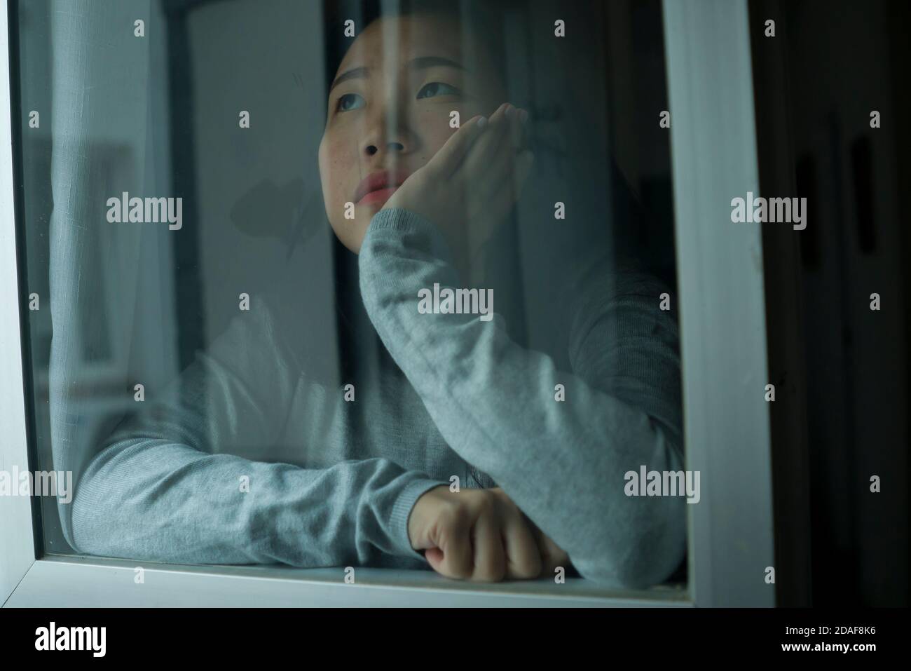 young sad and depressed Asian Korean girl scared and worried during ...