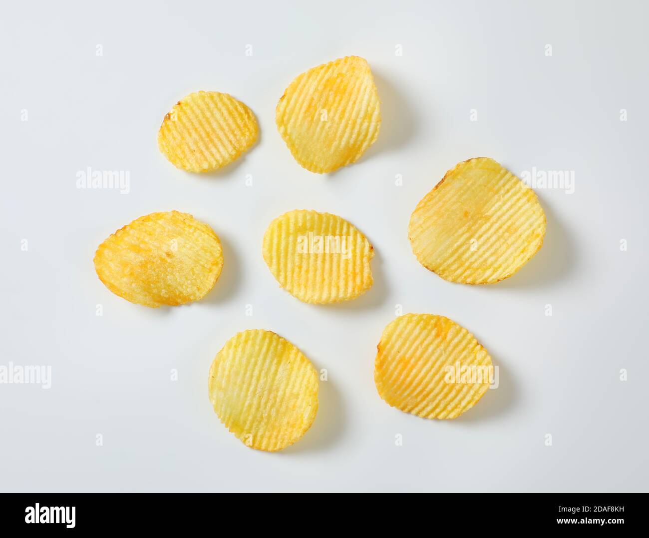 Six thin ridged potato chips Stock Photo - Alamy