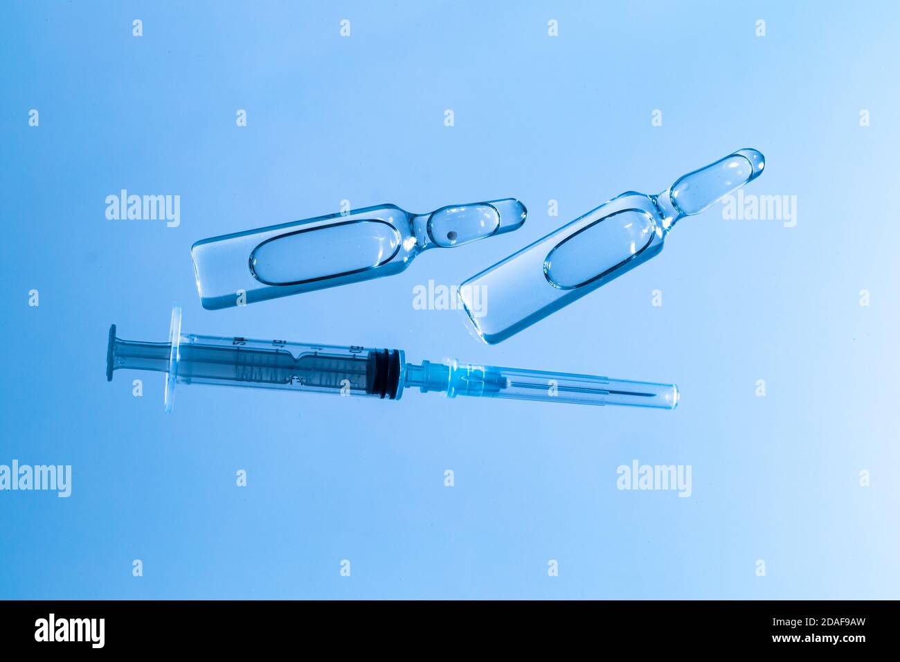 Medical vial with medication and syringe close up Stock Photo - Alamy