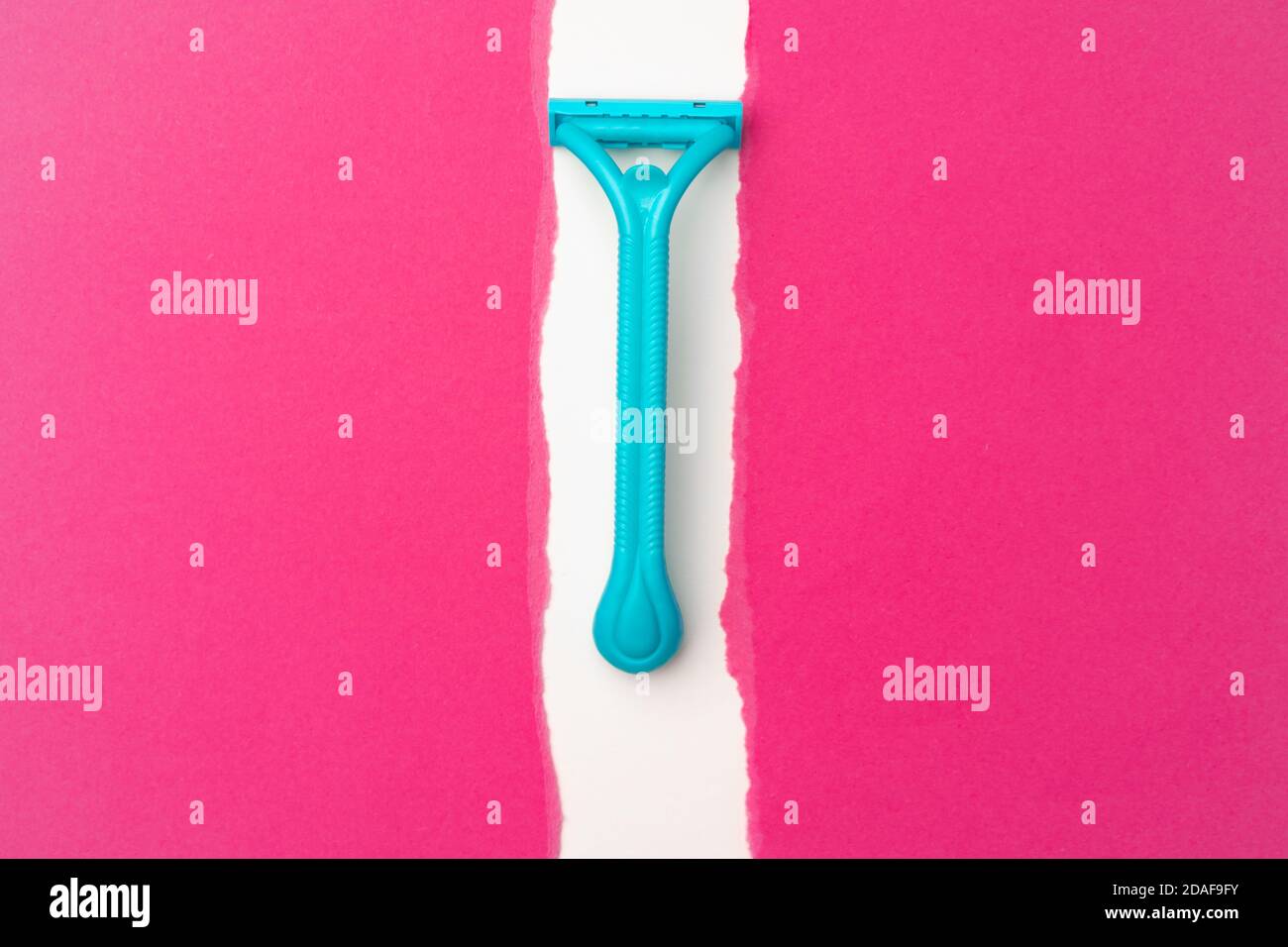 Female shaving razor on pink background top view Stock Photo - Alamy