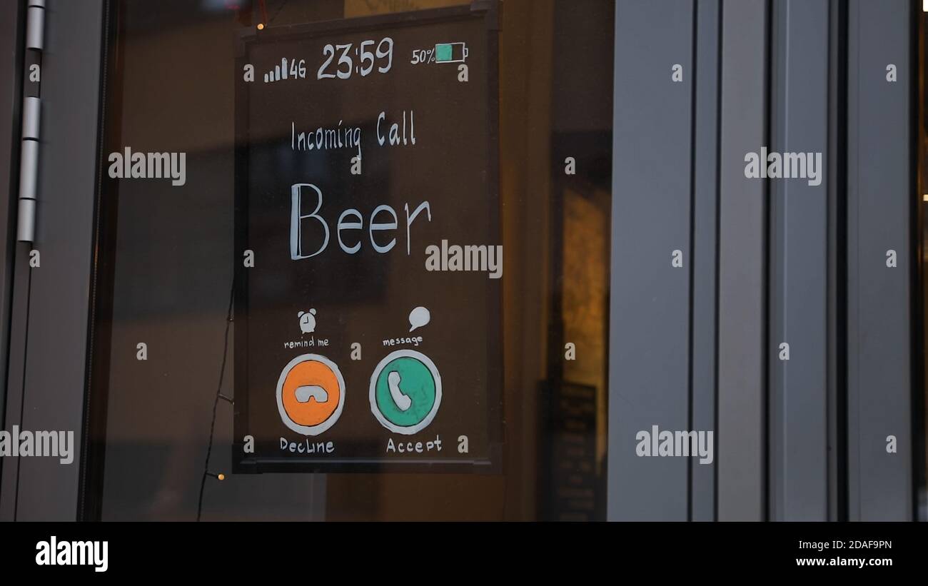 Incoming call: Beer. Creative funny sign behind glass Stock Photo - Alamy