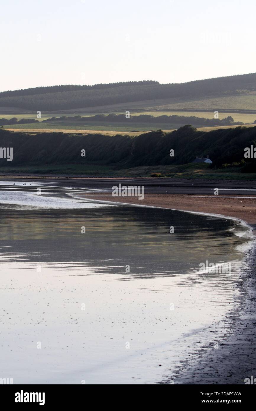 Croy Shore, Ayrshire, Scotland, Early morning light illuminates the ...