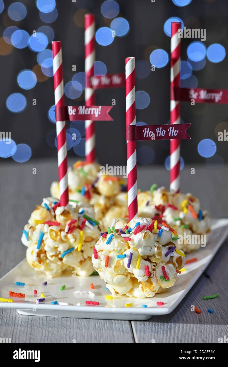 Holiday Popcorn Ball and Confetti Sprinkles Lollipop Stock Photo - Alamy