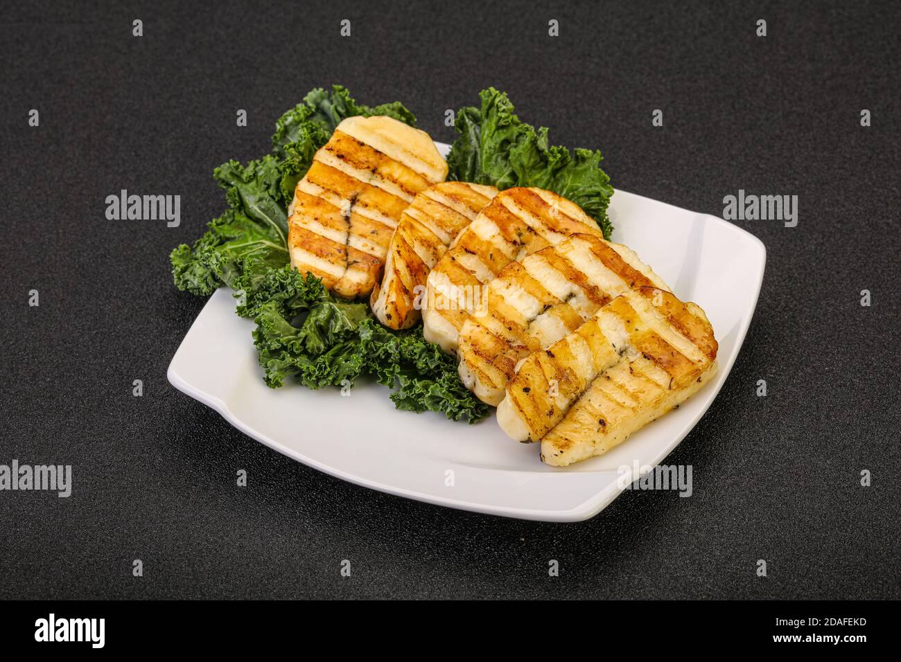 Grilled Greek haloumi cheese with herbs and spices Stock Photo - Alamy