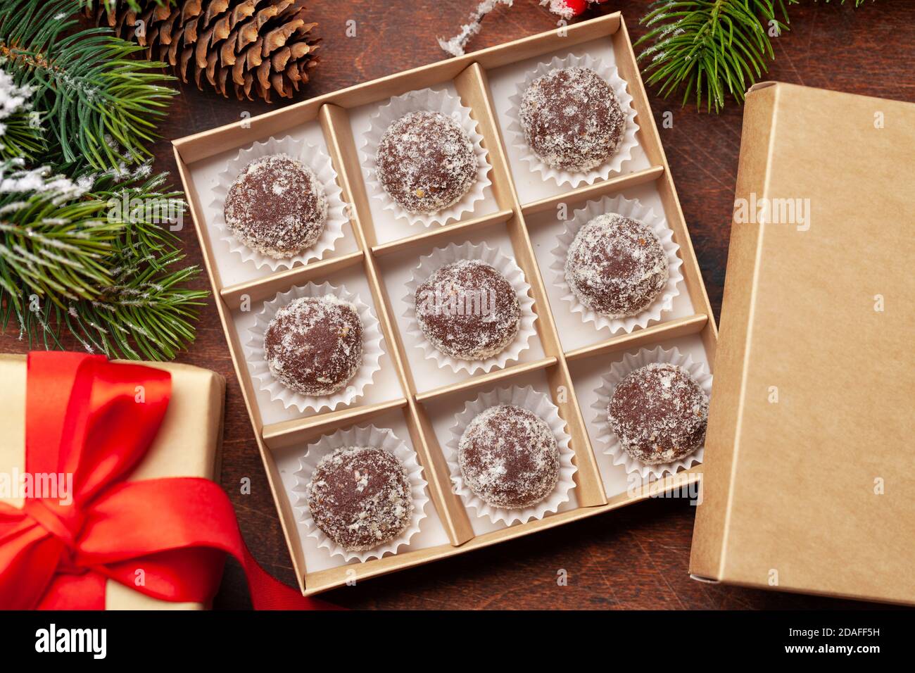 Homemade healthy vegetarian chocolate sweets in box. Top view flat lay ...