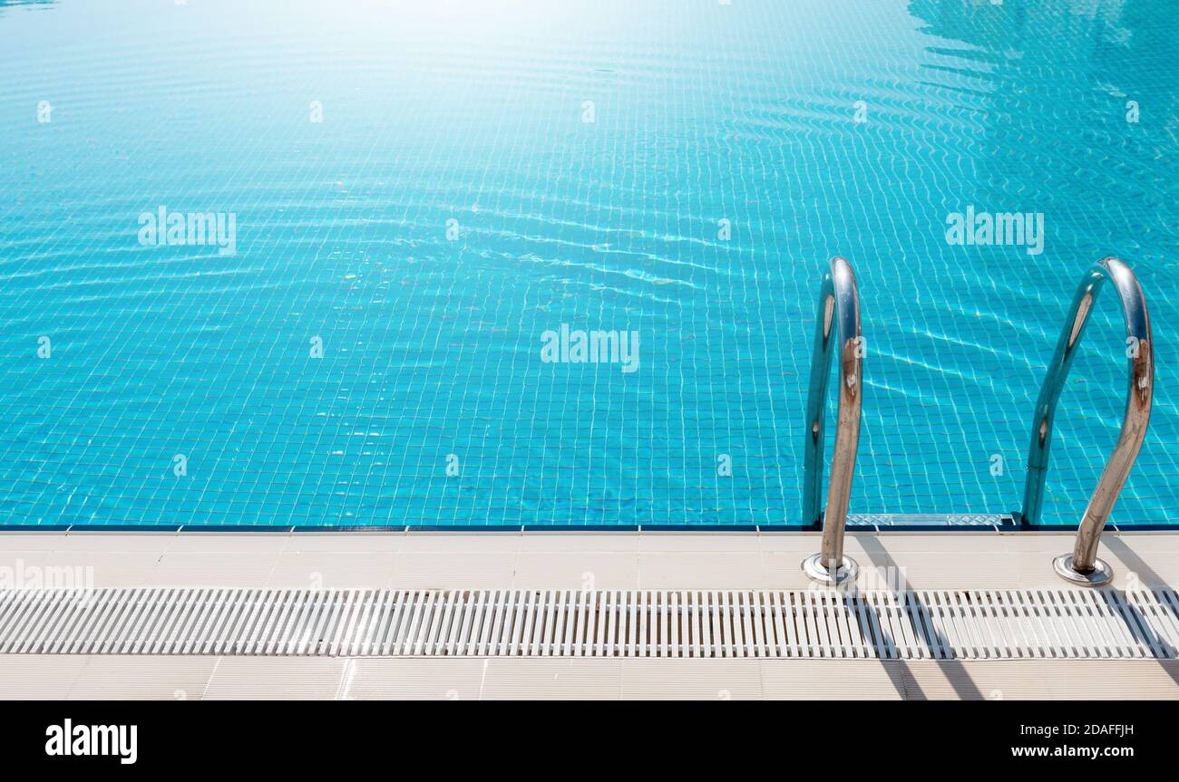 Sunny swimming pool in tropical resort. Summer vacation concept with ...