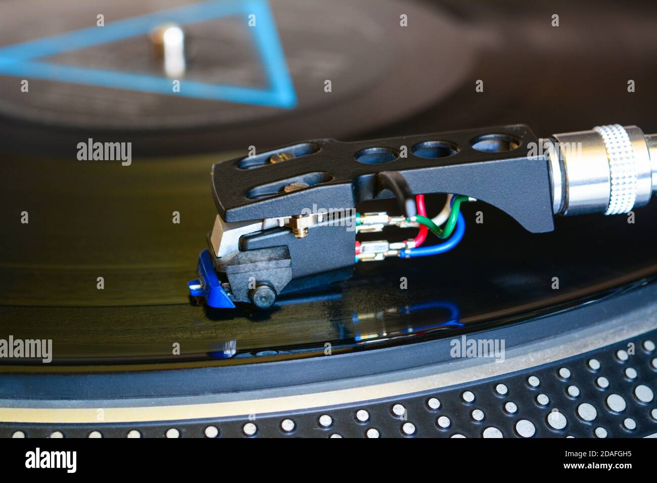 Audiophile cartridge mounted in shell played on turntable. Vinyl ...