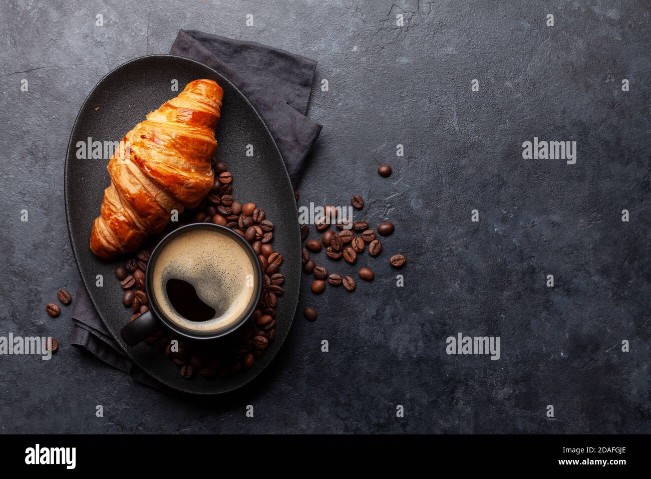 Espresso coffee and croissant for breakfast. Top view flat lay with copy space Stock Photo - Alamy